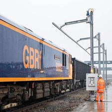 Trial uses moveable overhead cables for freight trains